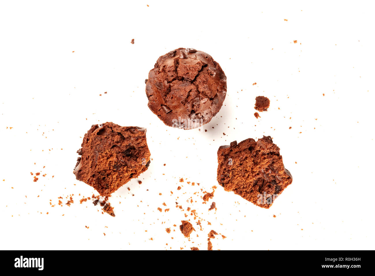 An overhead photo of messy chocolate muffins with crumbs, shot from ...