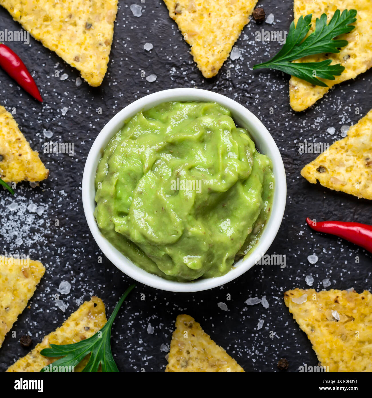 Guacamole and Corn Chips close-up. Traditional Latin American Food on ...