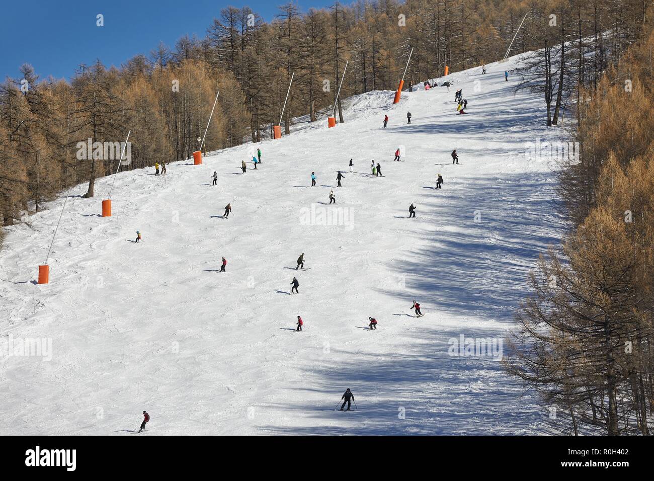 Skiing slopes with skiers Stock Photo - Alamy