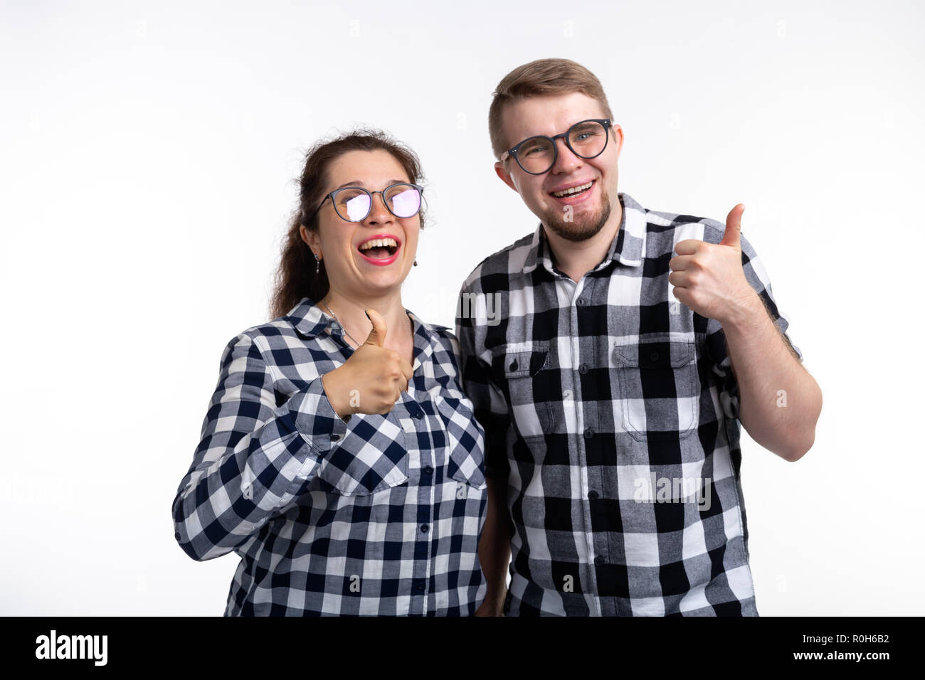 Nerds, geek, bespectacled and funny people concept - a couple of nerds ...