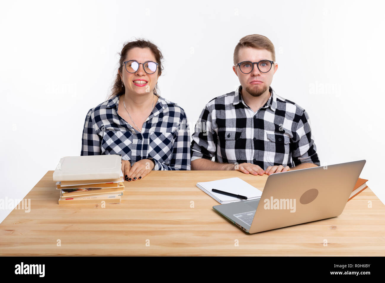 Education, students, people concept - funny couple of teens in glasses ...