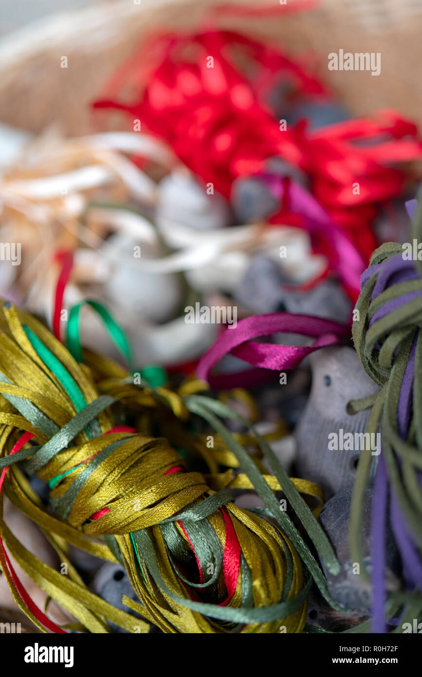 Multicolored narrow rolled ribbon Stock Photo - Alamy