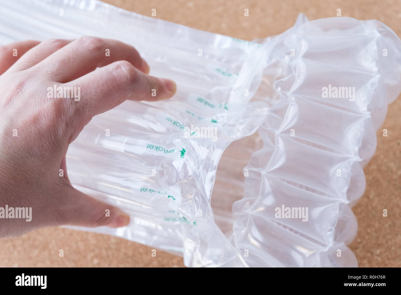 translucent air packaging hands hold, plastic packaging Stock Photo - Alamy