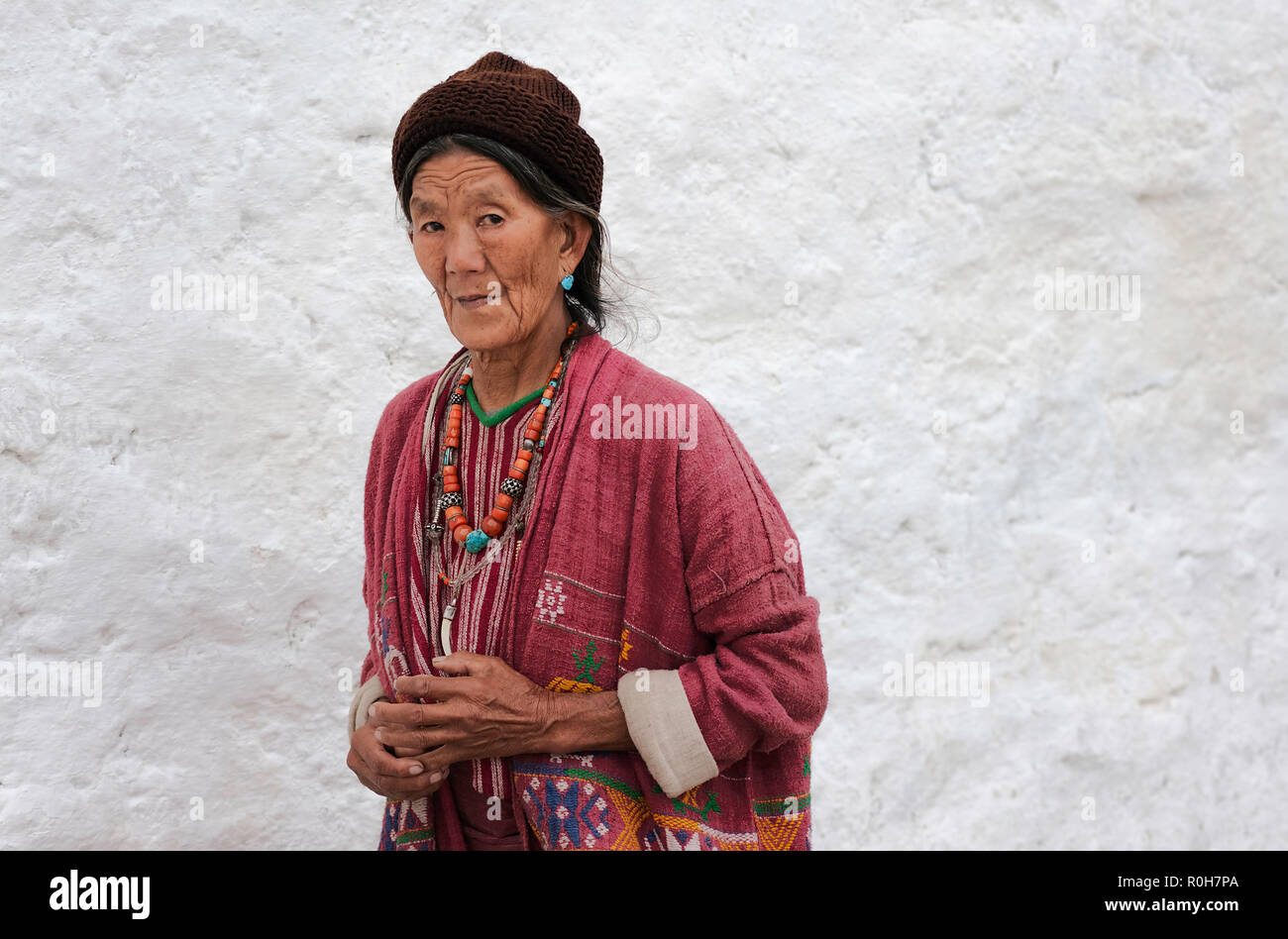 Woman of the Monpa tribe attending a festival wearing traditional ...