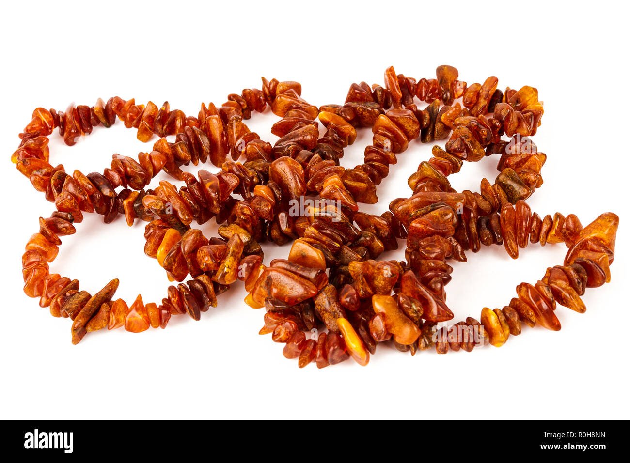 String of baltic amber beads isolated on white background. Bright ...