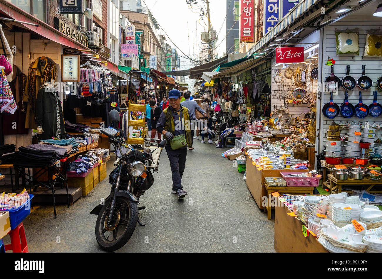 Busy street market scene in Busan, South Korea. Street is full or ...