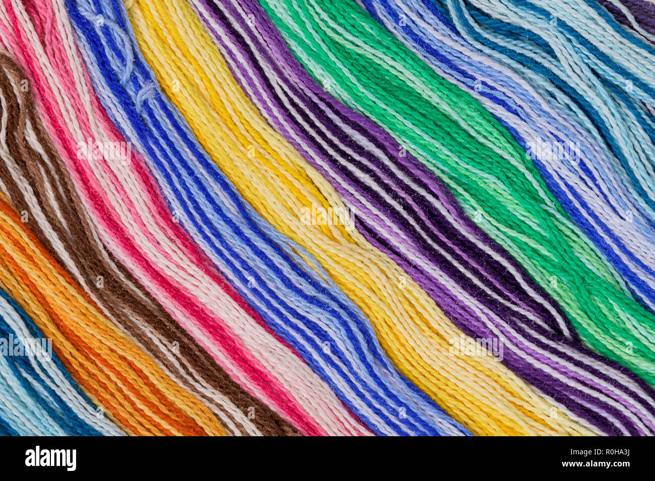 Long strands of colorful yarn in diagonal lines Stock Photo - Alamy