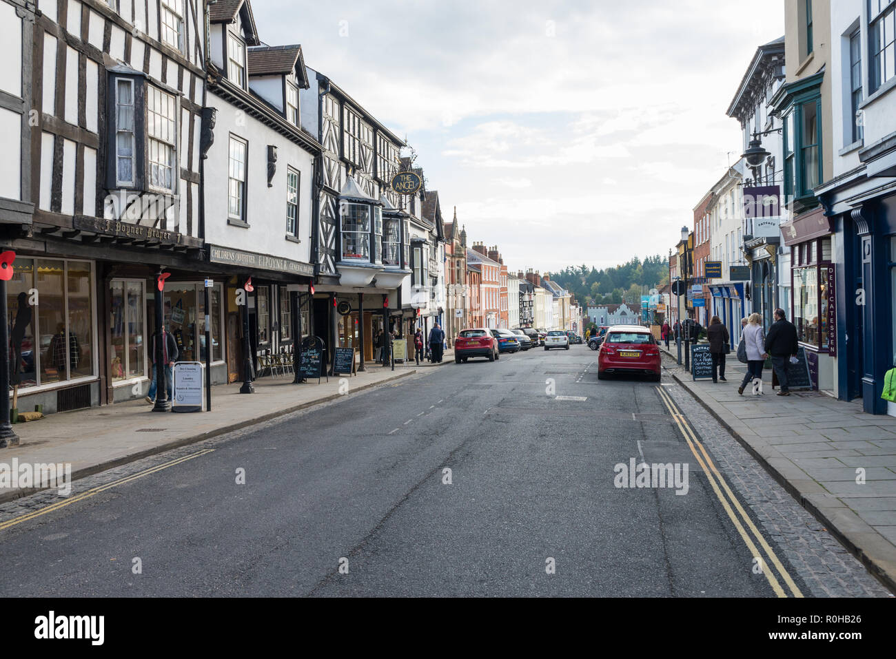 Shops and restaurants in old black and white timber-framed buildings in ...
