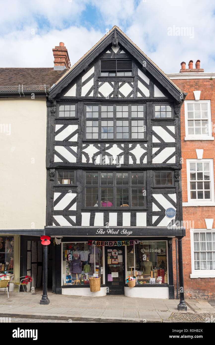 Shops and restaurants in old black and white timber-framed buildings in ...