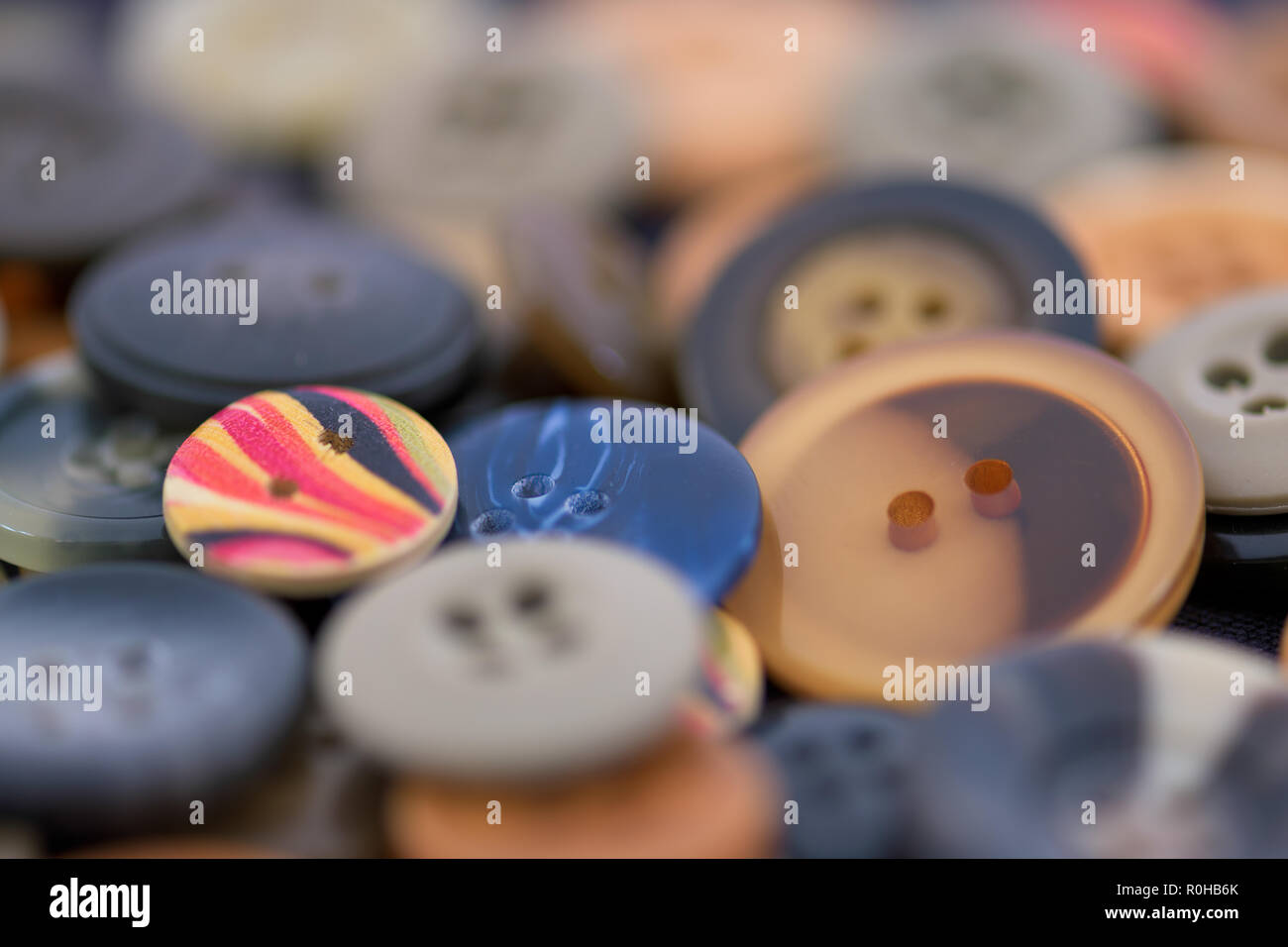 Large group of round plastic buttons in a variety of colors and sizes ...