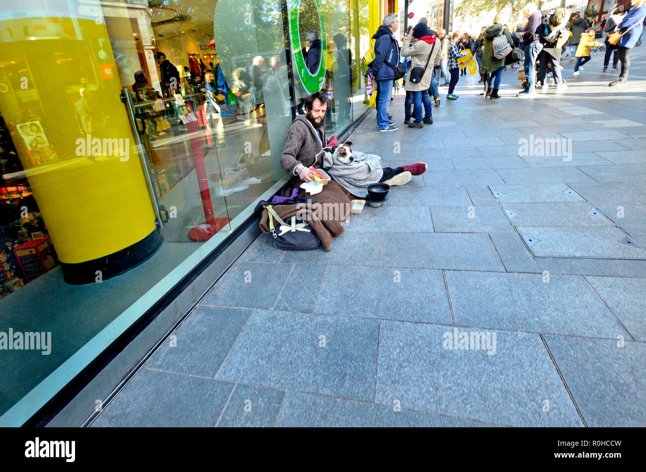 Homeless man sleeping rough in Leicester Square, London, England, UK ...