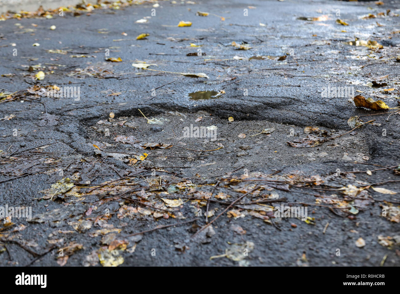 large pit with stones on the asphalt road Stock Photo - Alamy