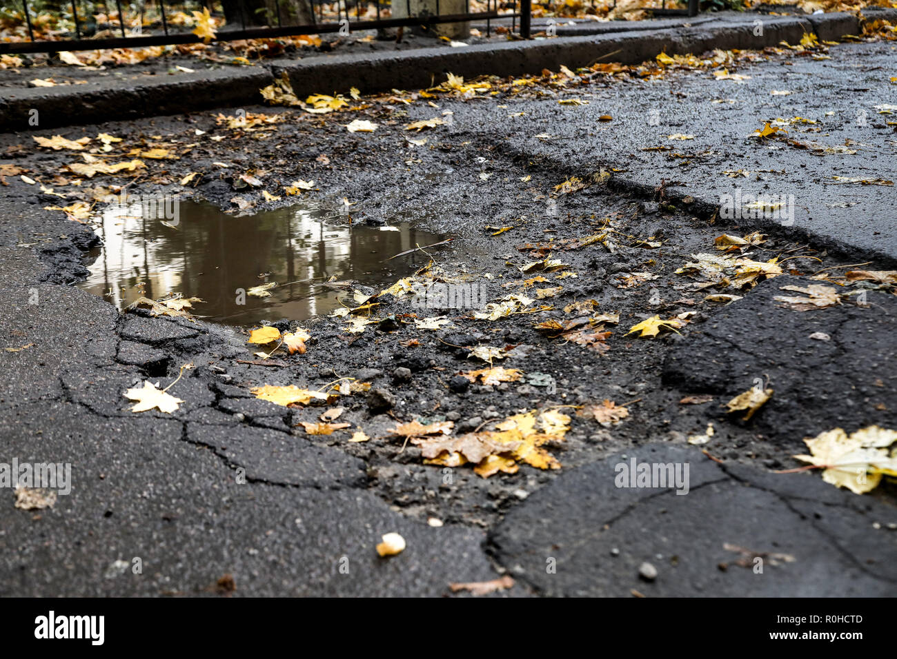 large pit with stones on the asphalt road Stock Photo - Alamy
