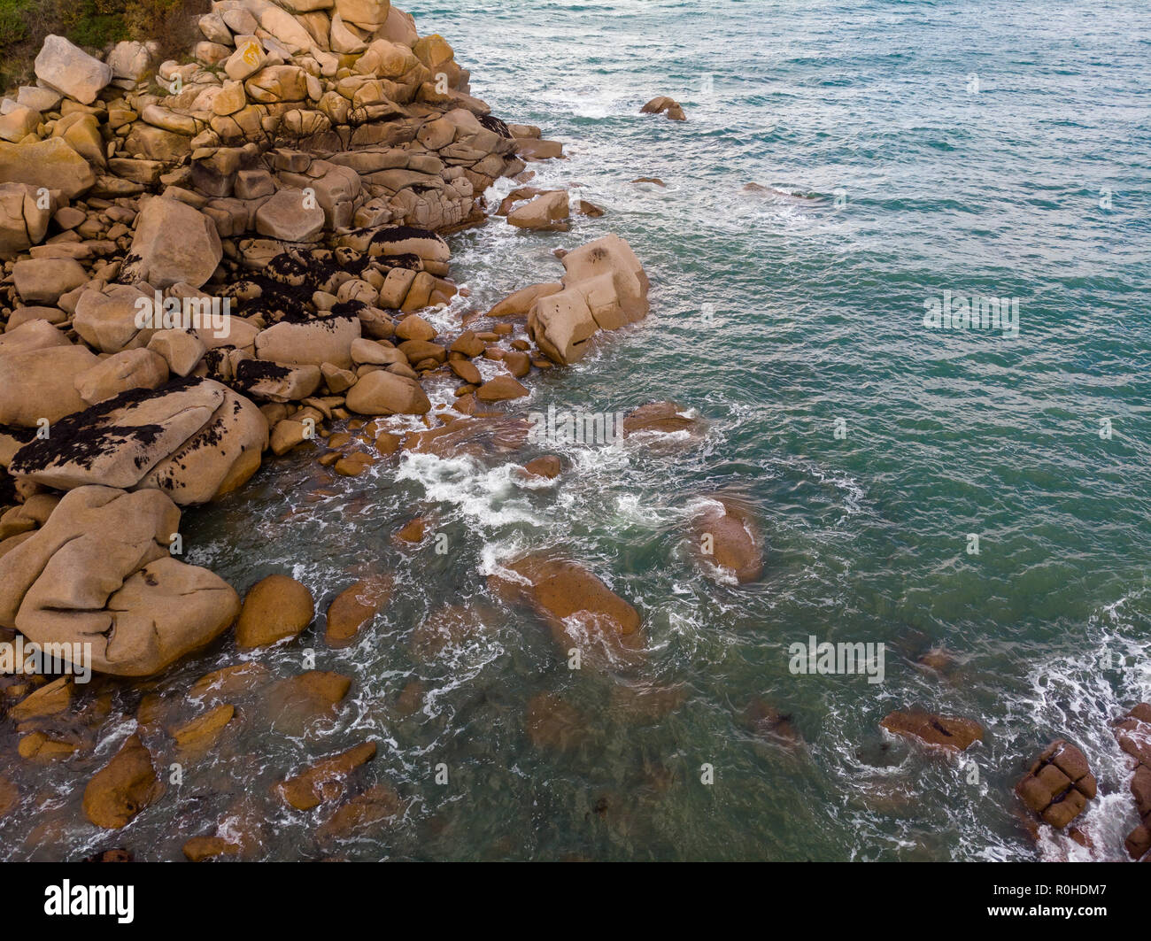 Drone view on round rocks on shore of atlantic ocean in northern France ...