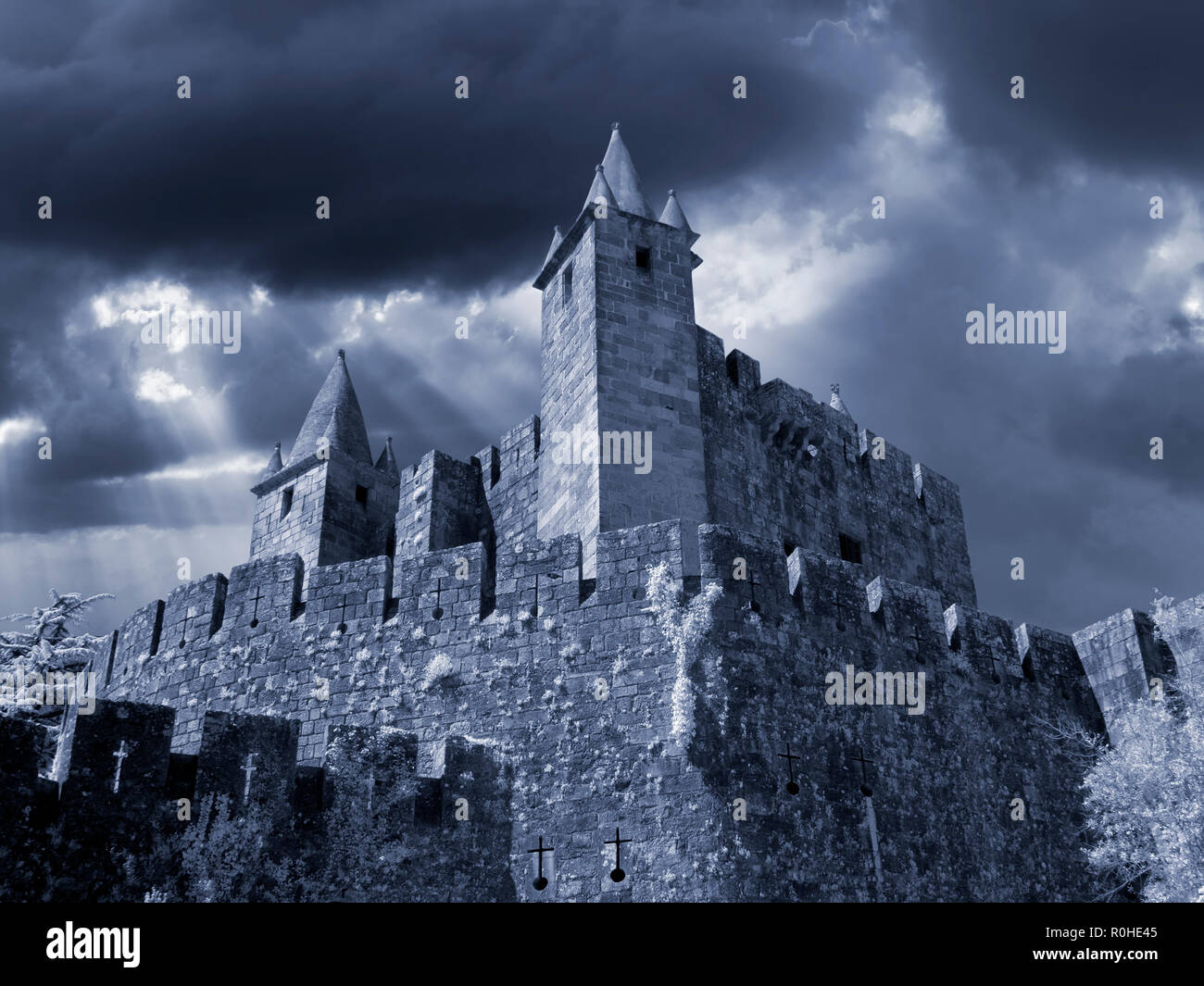 Old european granite castle. Enhanced sky. Used infrared filter. Toned ...