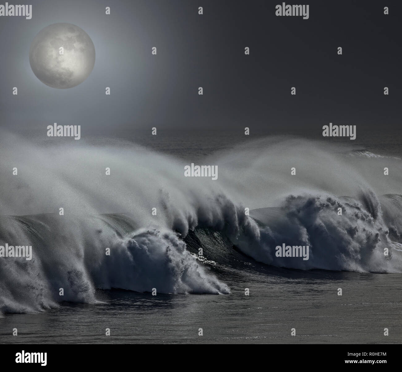 Big stormy detaled wave in a misty full moon night Stock Photo - Alamy