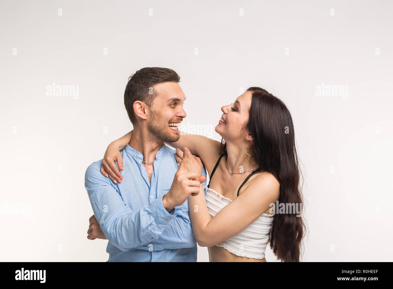 Emotions, fun and people concept - Funny couple laughing on white ...