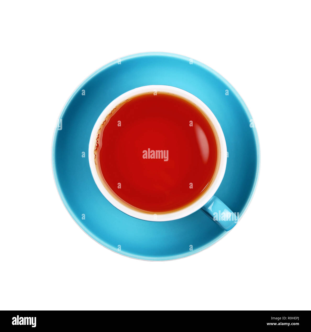 Full cup of black tea on blue saucer isolated on white background ...