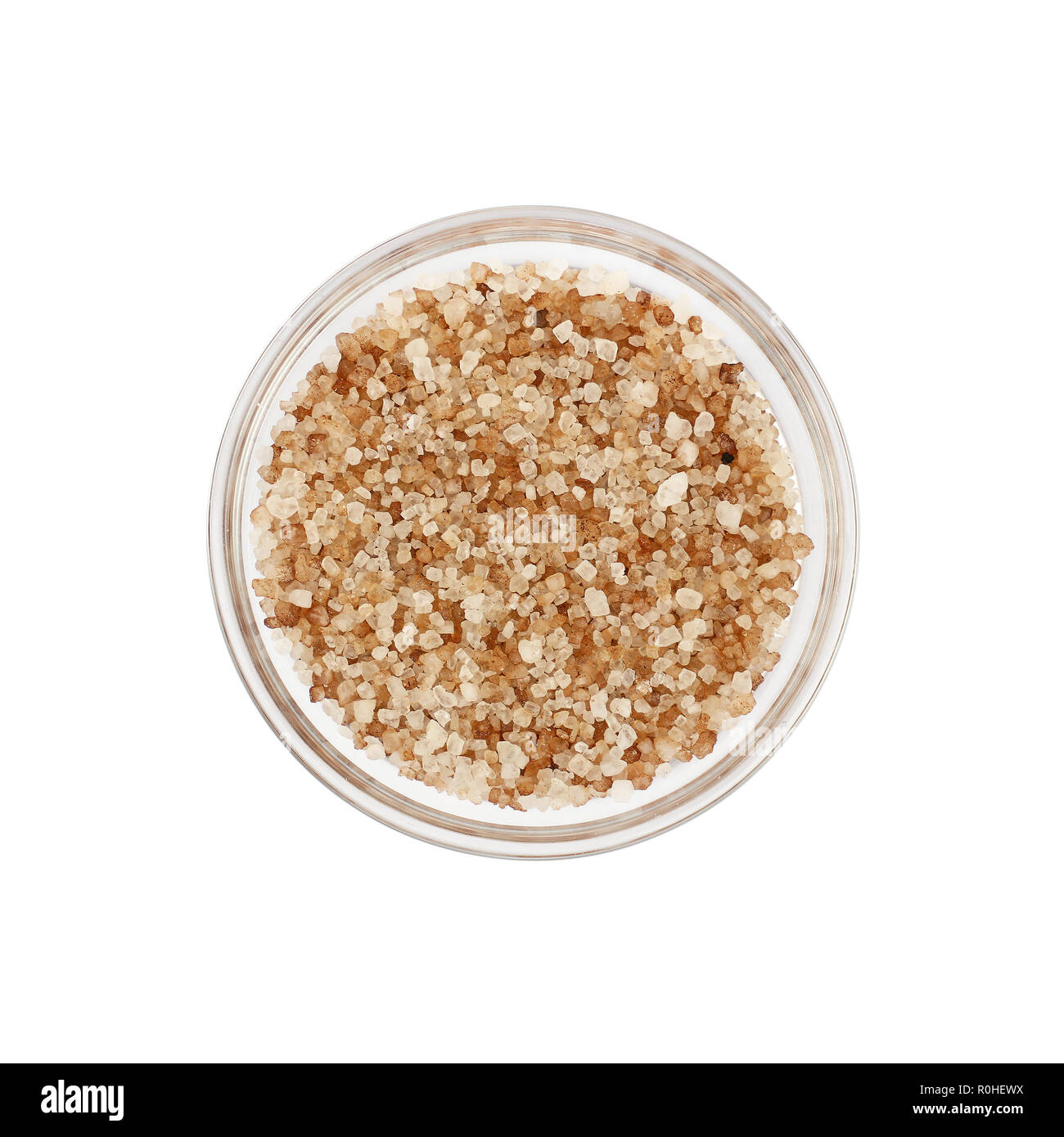 Close up one glass bowl saltcellar full of crystals brown smoked Danish ...