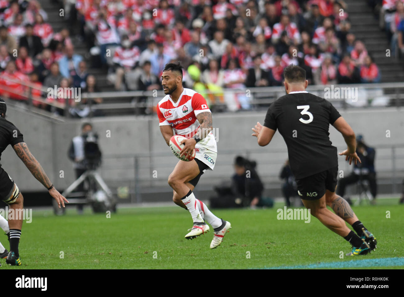 Jamie Henry of Japan runs with the ball during the Rugby test match ...