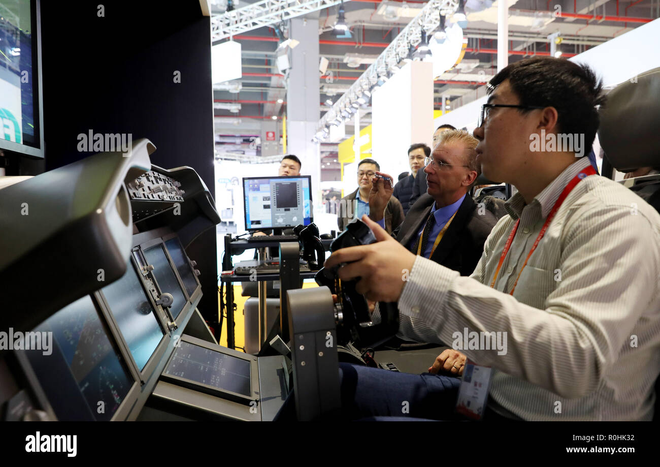 Shanghai, China. 5th Nov, 2018. A visitor experiences Boeing 787 flight ...