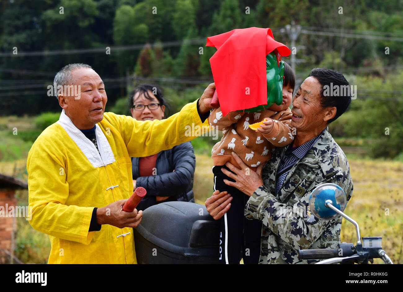 Shaowu. 4th Nov, 2018. A dancer introduces Nuo dance to villagers in ...