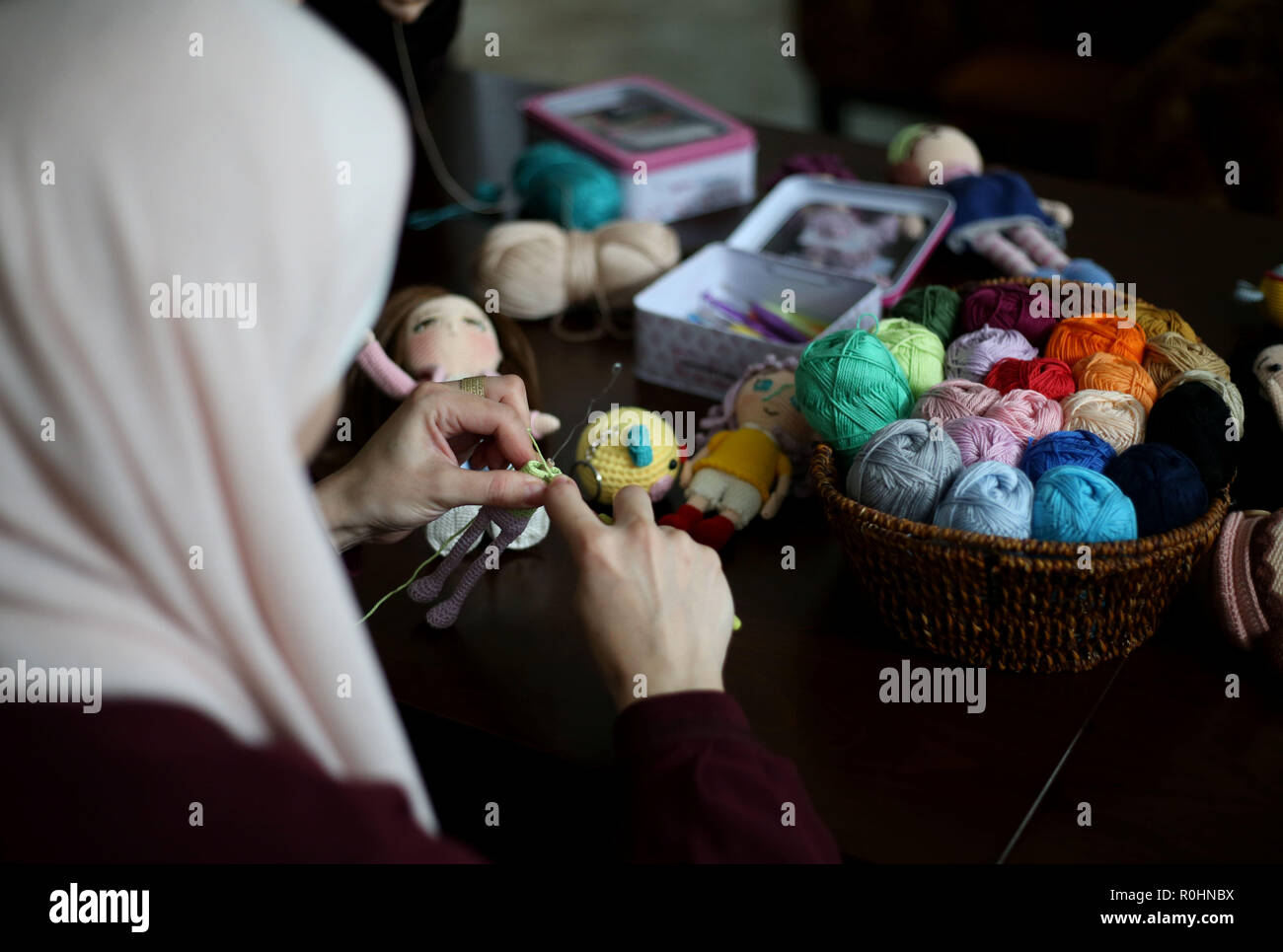 Nablus. 4th Nov, 2018. Palestinian woman Alaa Abdo makes wool dolls in ...