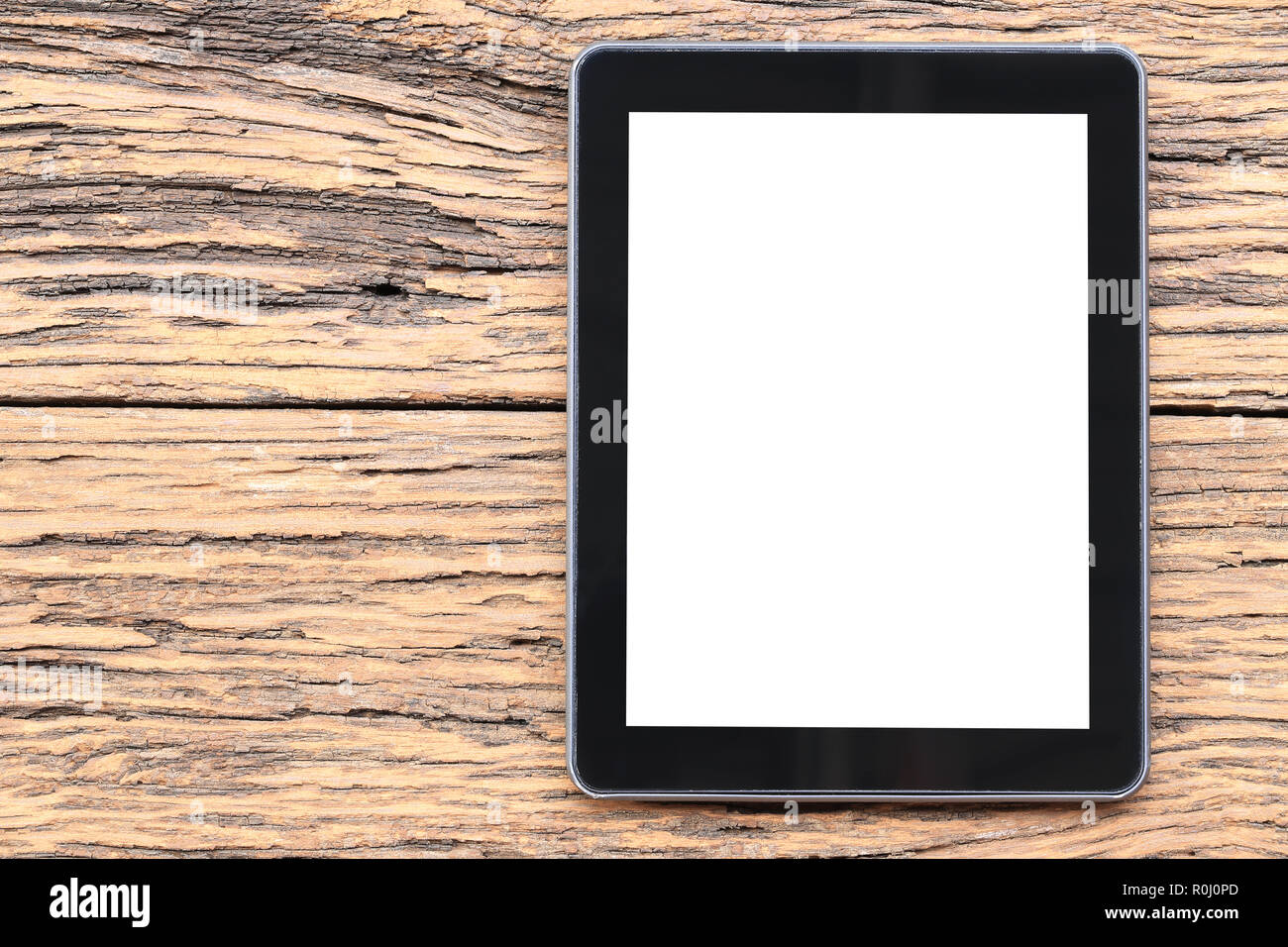 empty tablet on brown wooden floor and have copy space for design in ...