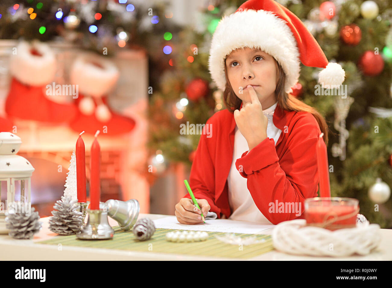 Portrait of a cute little girl writing letter Stock Photo - Alamy