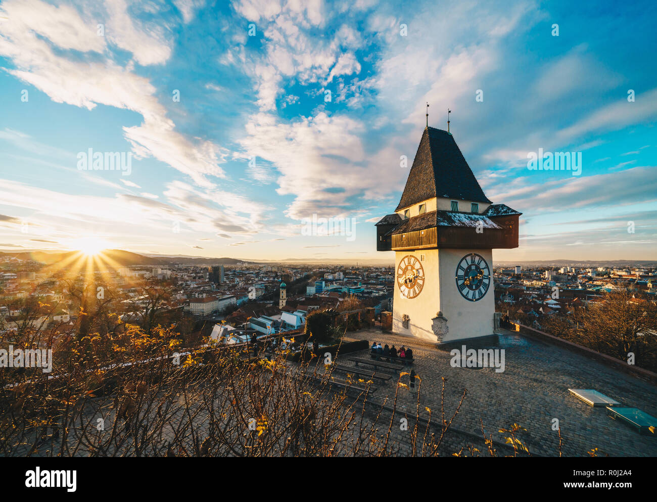 Graz city landmark Schlossberg park tower at sunset and city panorama ...