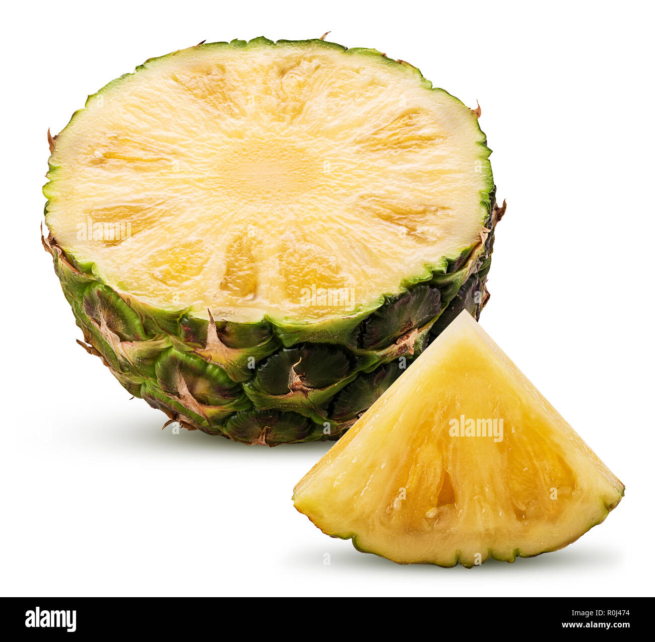 Pineapple fruit cut in half and slice isolated on white background ...