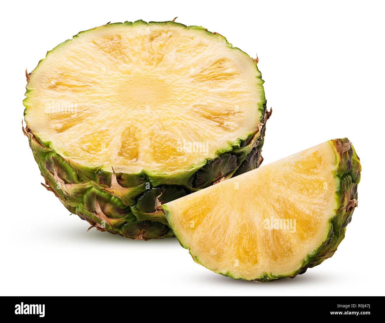 Pineapple fruit cut in half and slice isolated on white background ...