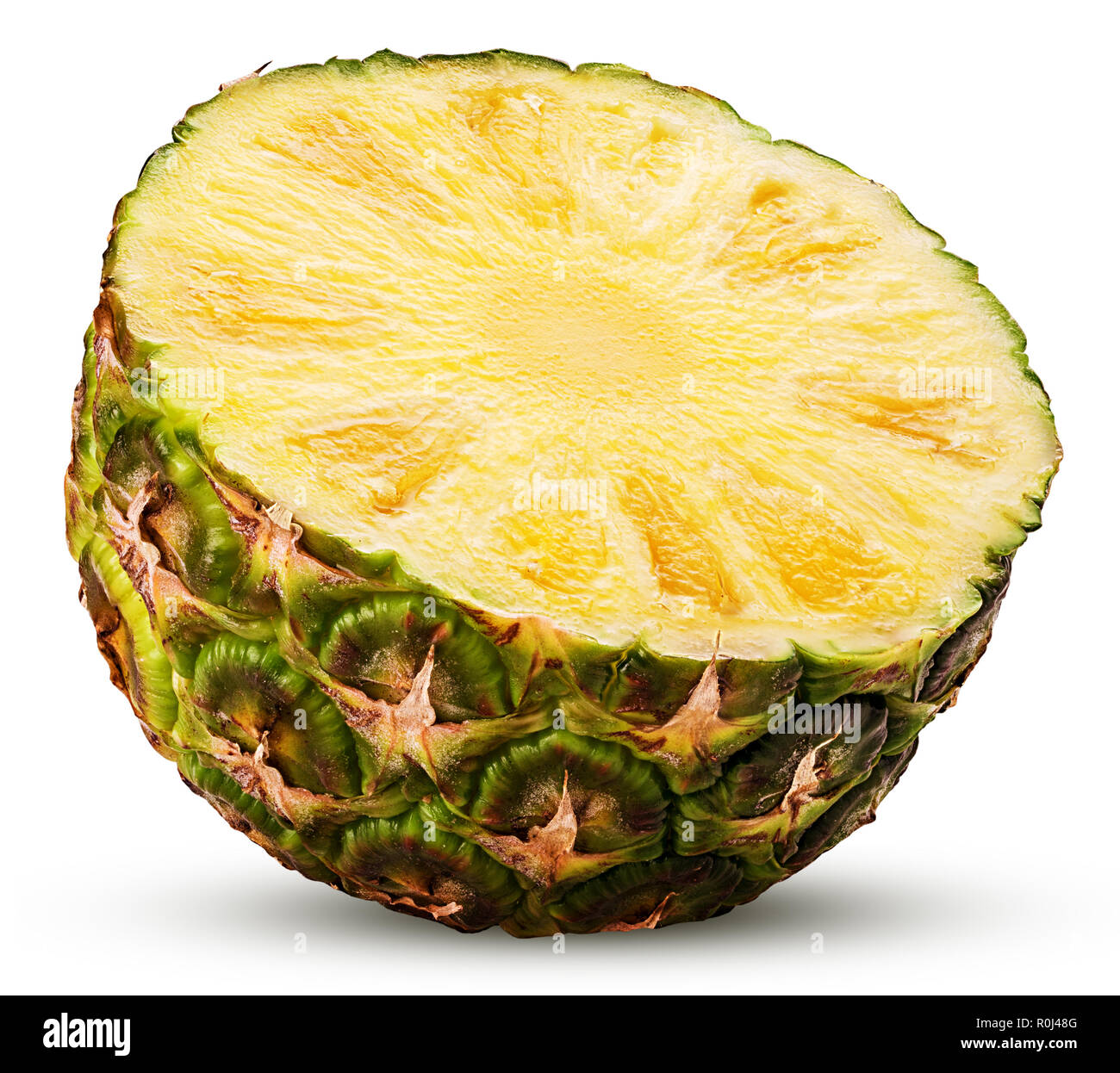 Pineapple fruit cut in half isolated on white background. Clipping Path ...