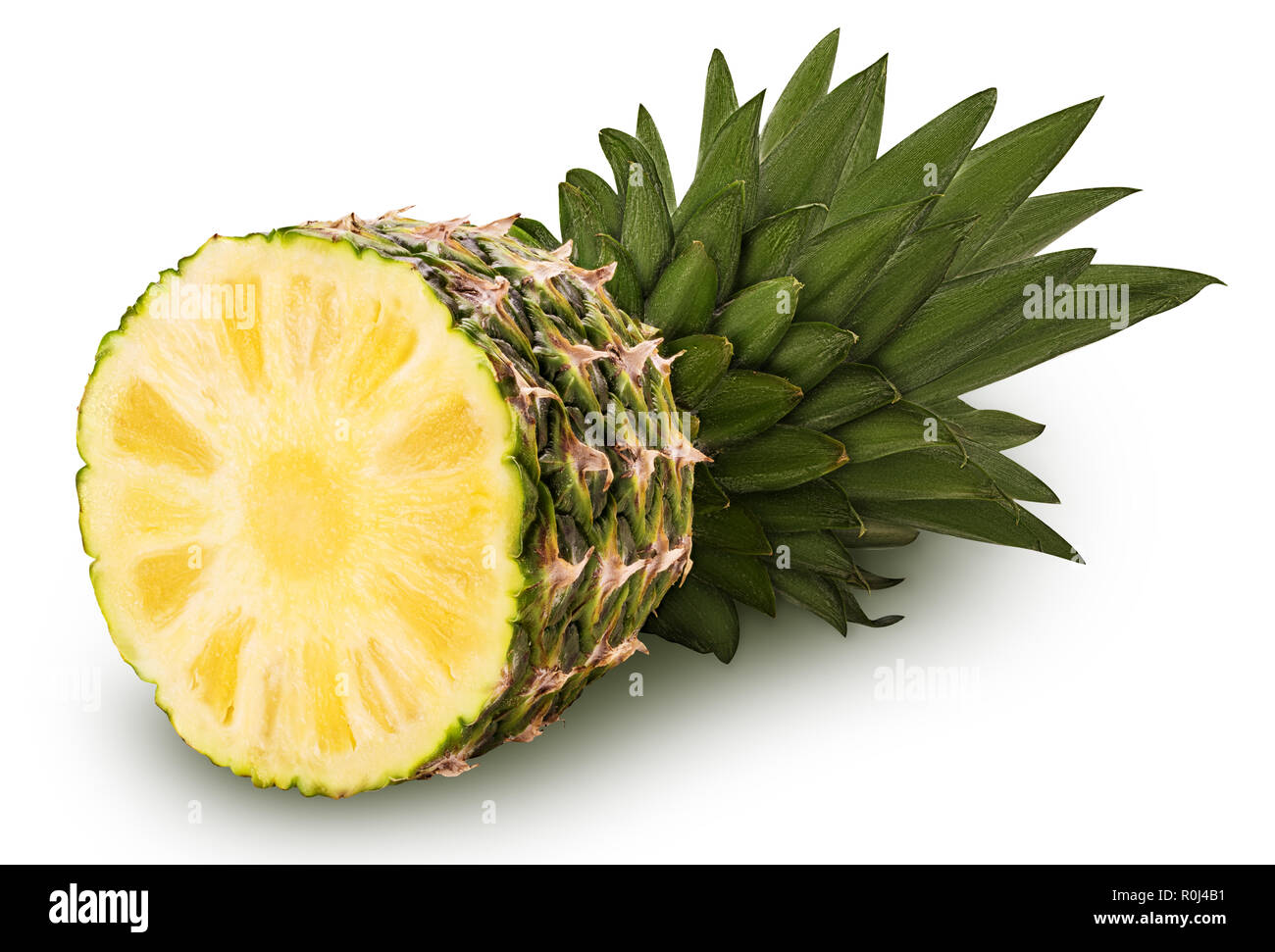Pineapple fruit cut in half isolated on white background. Clipping Path ...