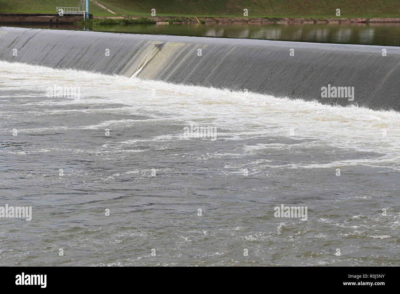 Dike of overflow water in day time for design concept about to ...