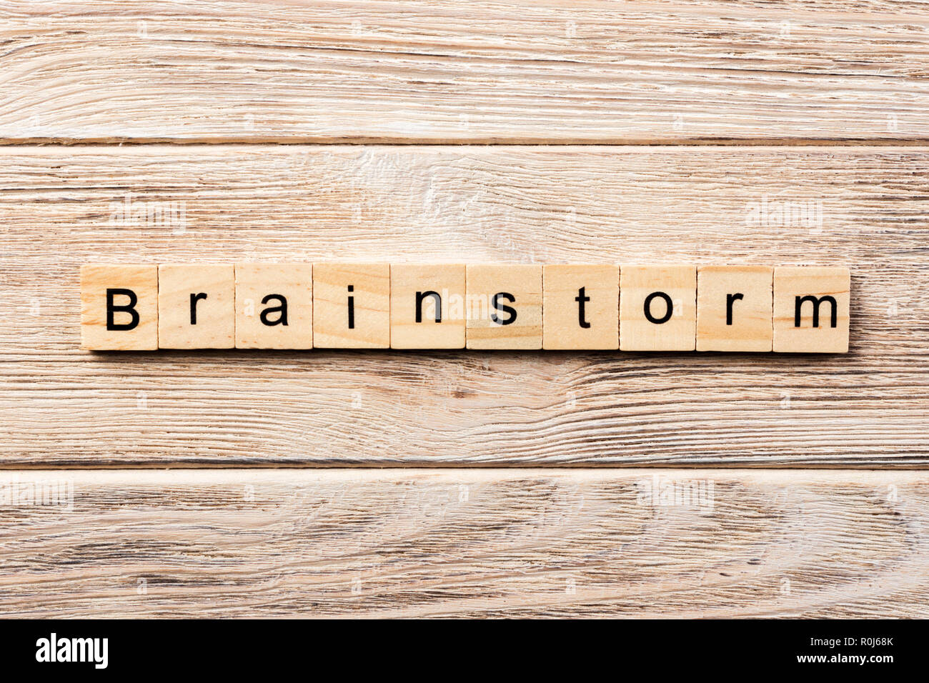 brainstorm word written on wood block. brainstorm text on table ...
