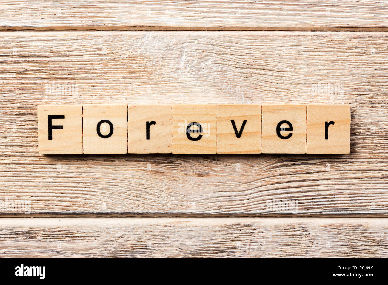 forever word written on wood block. forever text on table, concept ...