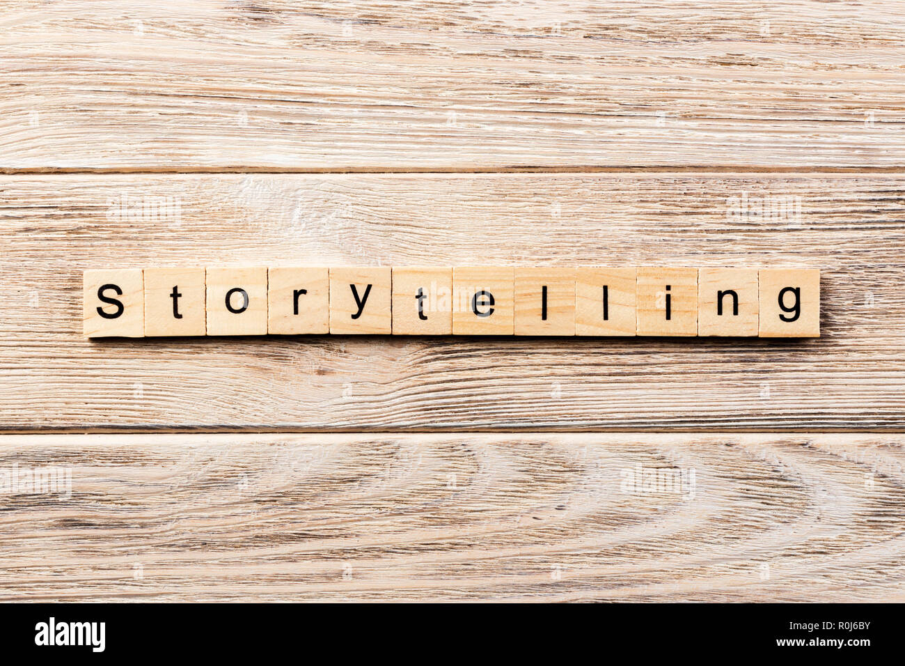 storytelling word written on wood block. storytelling text on table ...