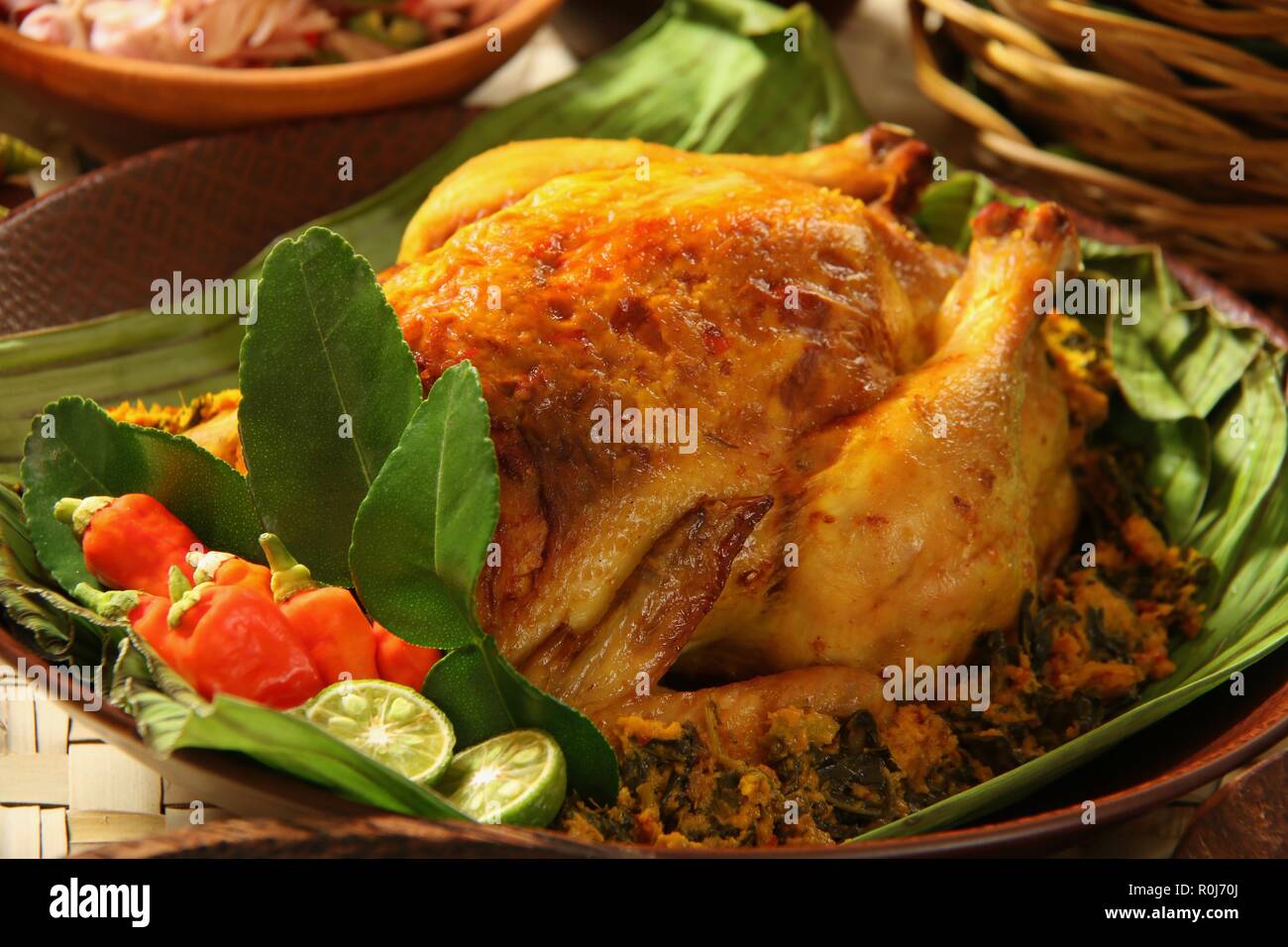 Ayam Betutu. Balinese spicy roast chicken with cassava leaves sutffing ...