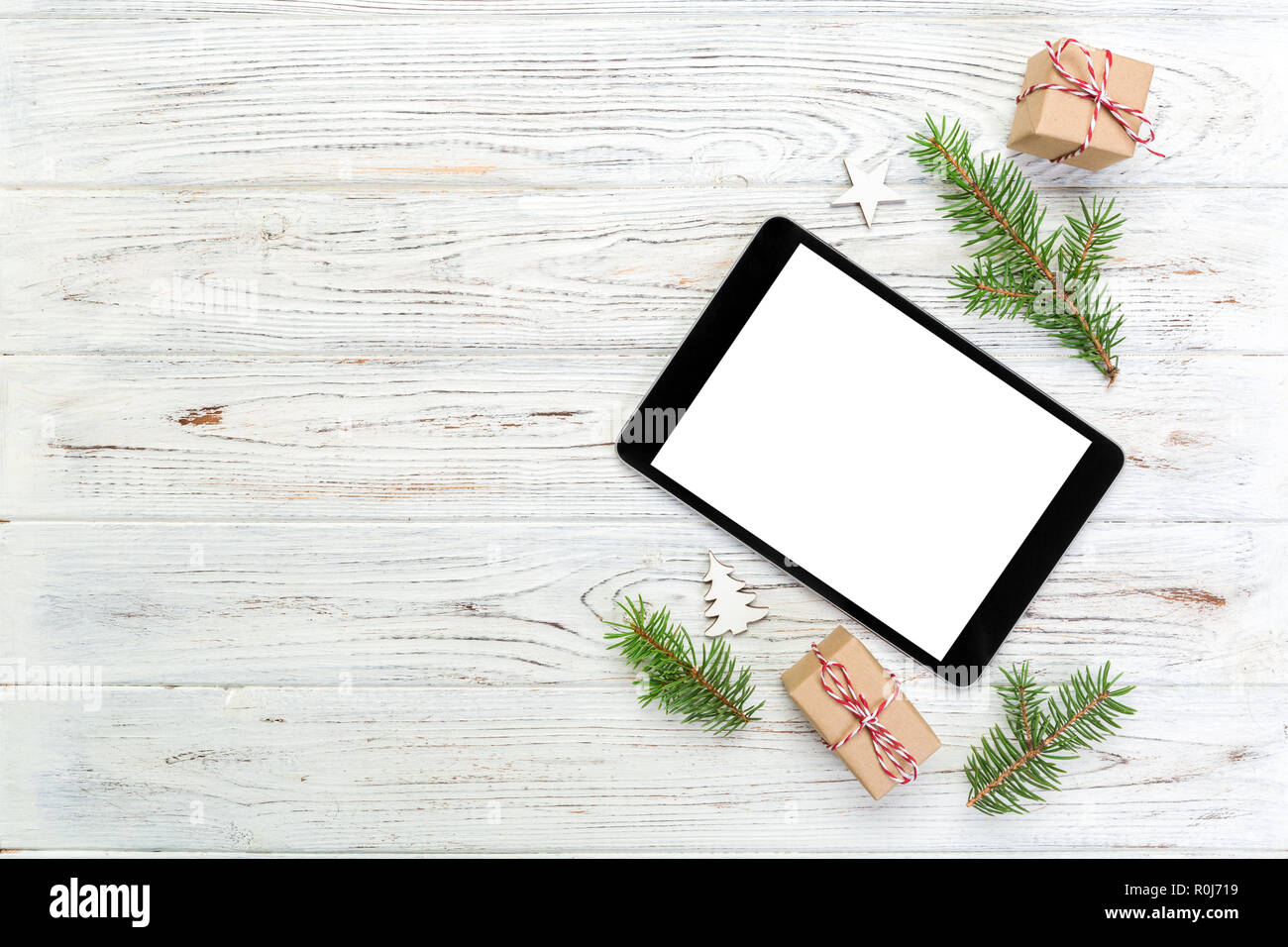 Digital tablet mock up with rustic Christmas wooden background ...