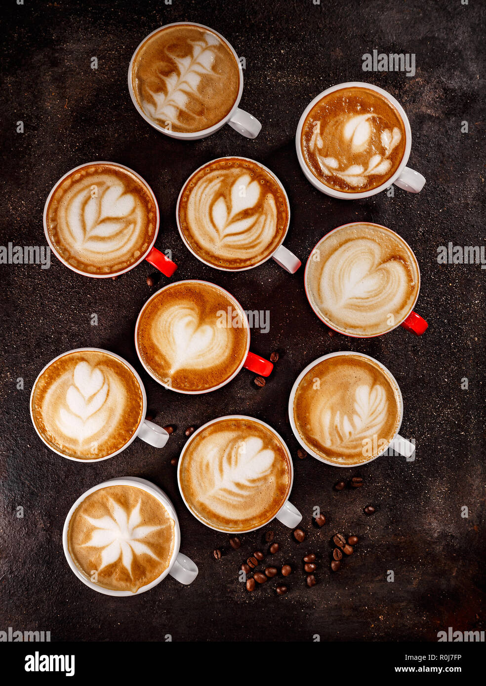 Flat lay of hot coffee latte art set on vintage dark background Stock ...