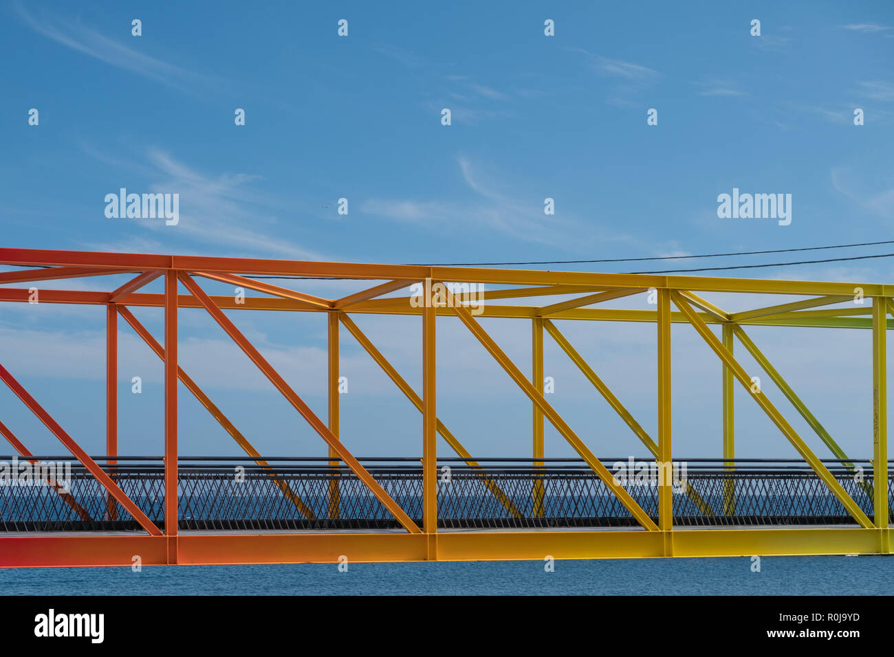 rainbow colored bridge with ocean background - colorful steel bridge ...