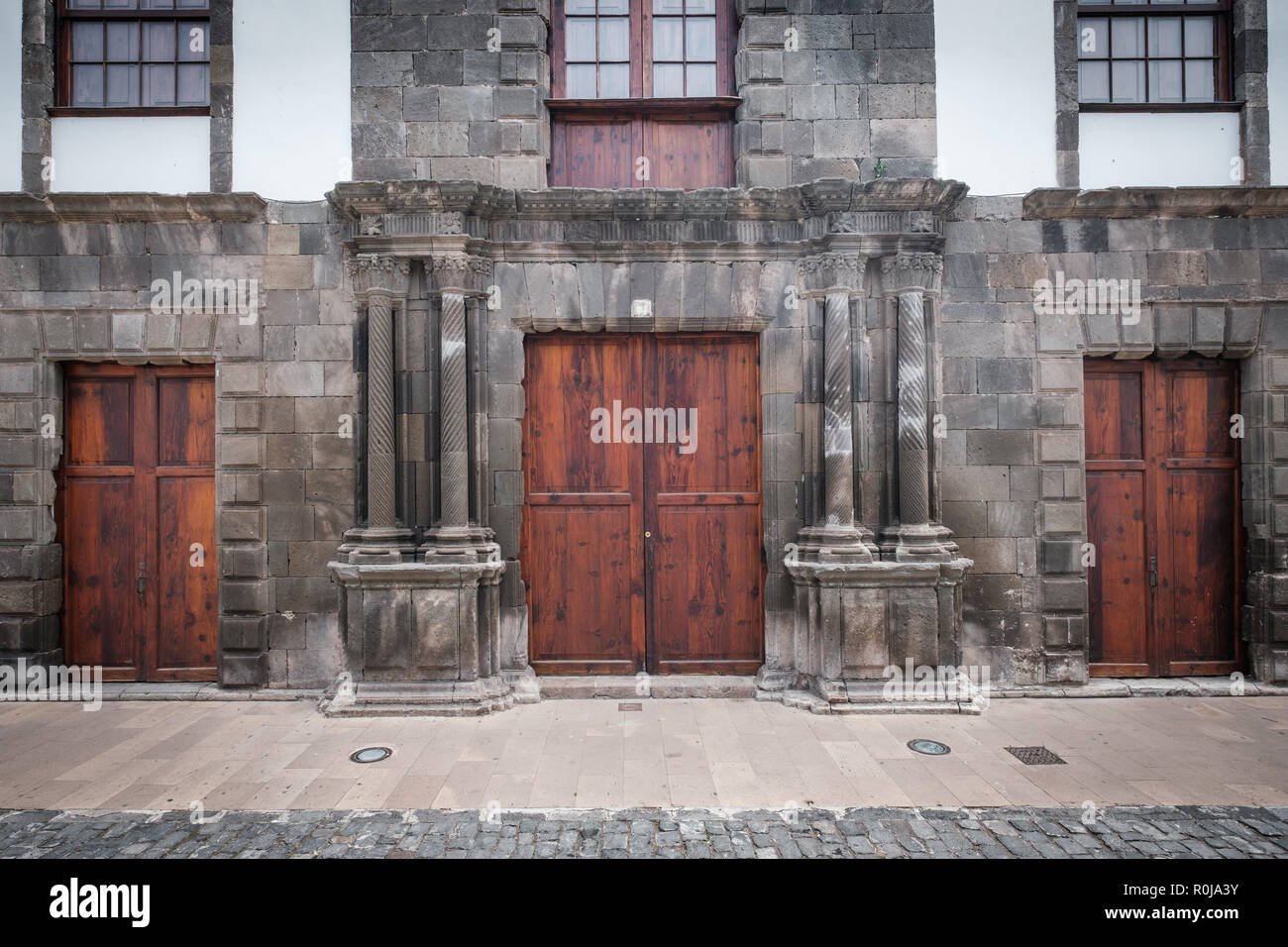 front of historic building facade with wooden doors Stock Photo - Alamy