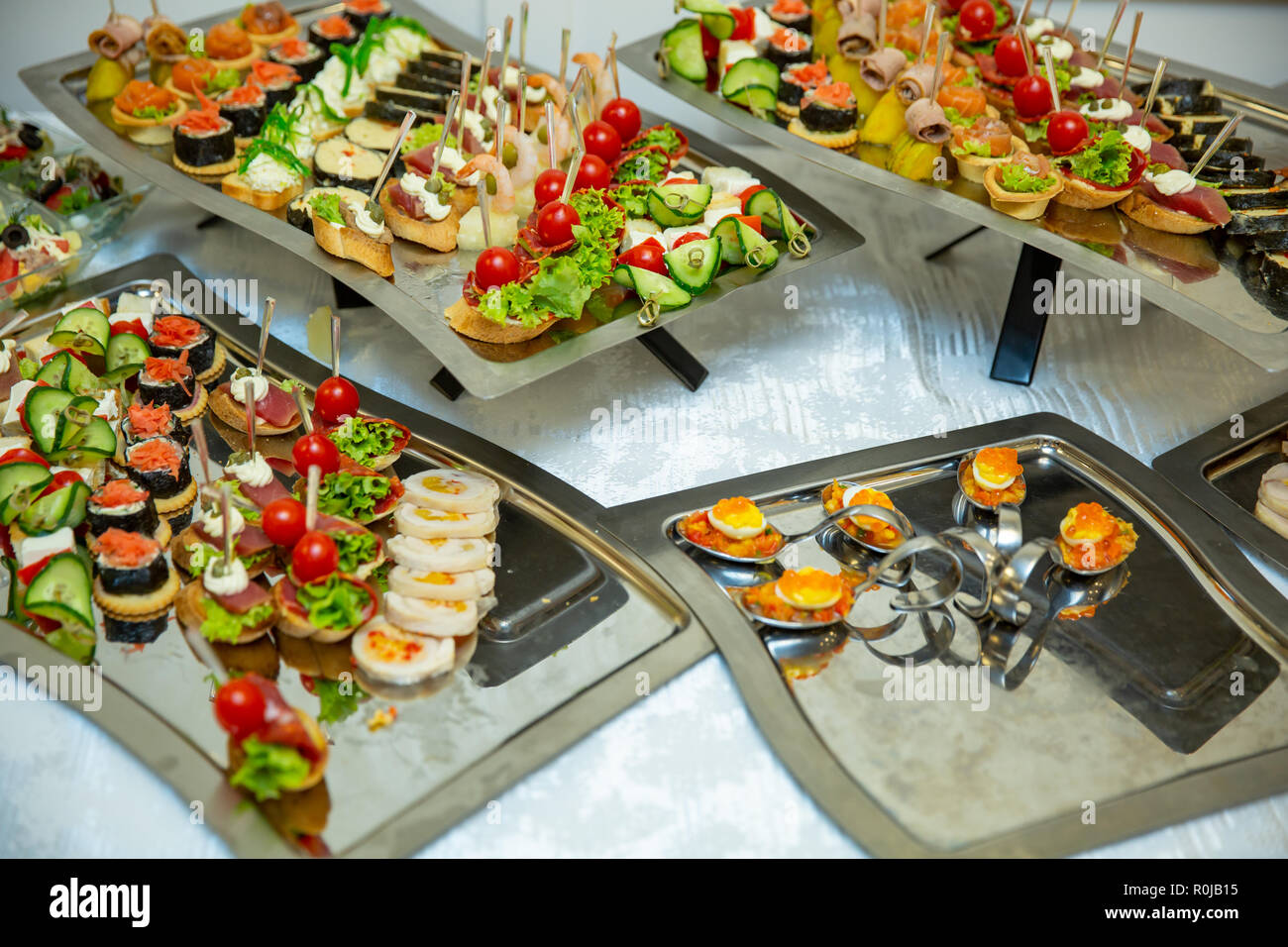 Catering table set service various snacks on a table at banquet. Set of ...
