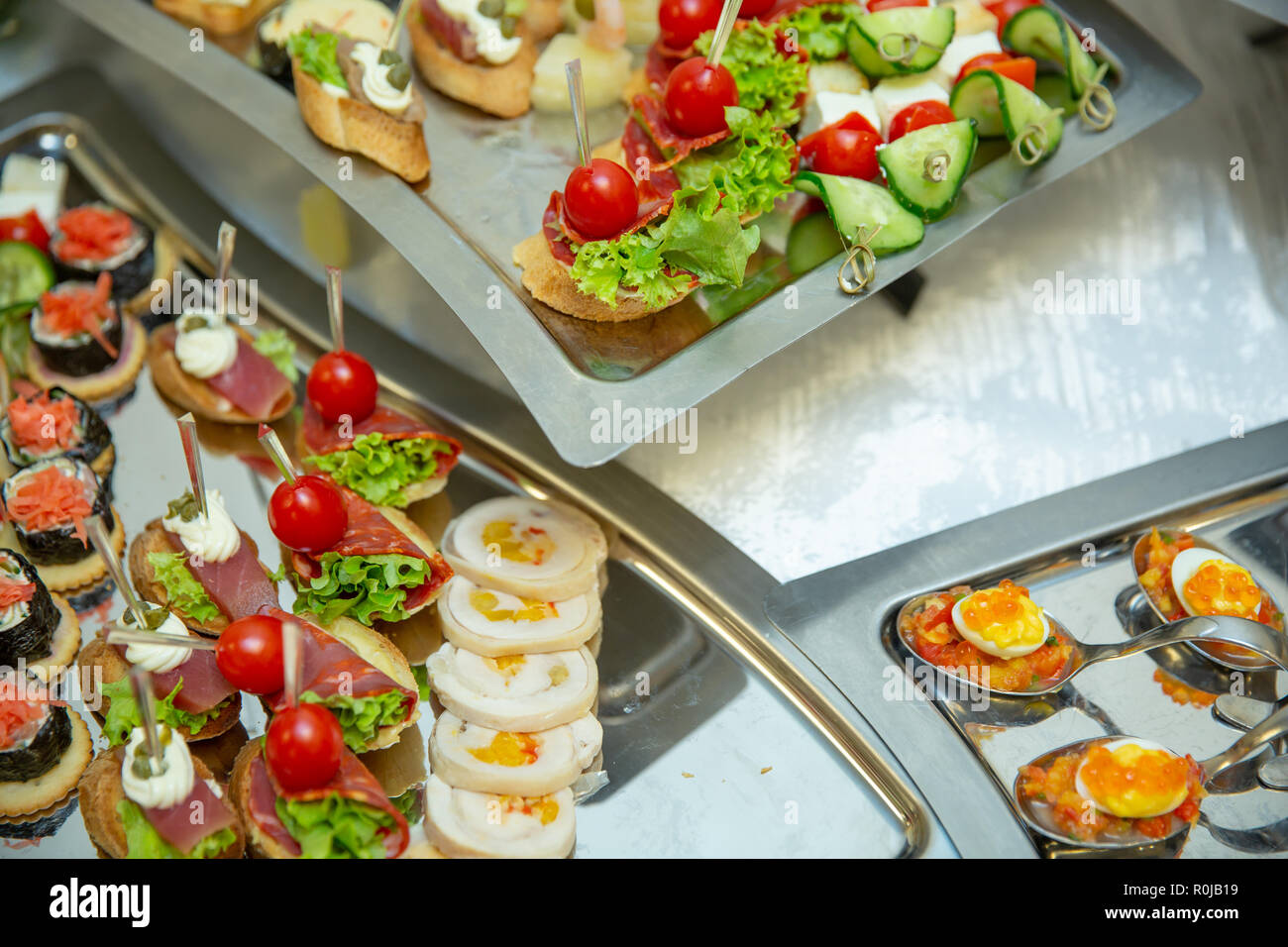 Catering table set service various snacks on a table at banquet. Set of ...