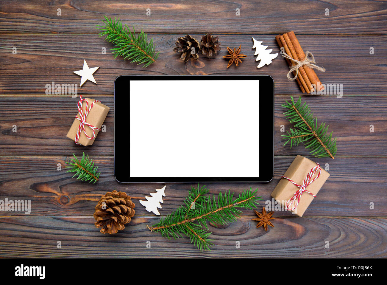 Digital tablet mock up with rustic Christmas wooden background ...