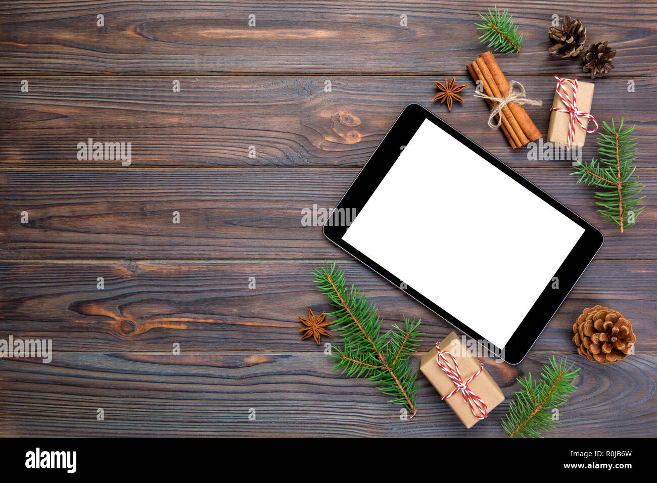 Digital tablet mock up with rustic Christmas wooden background ...