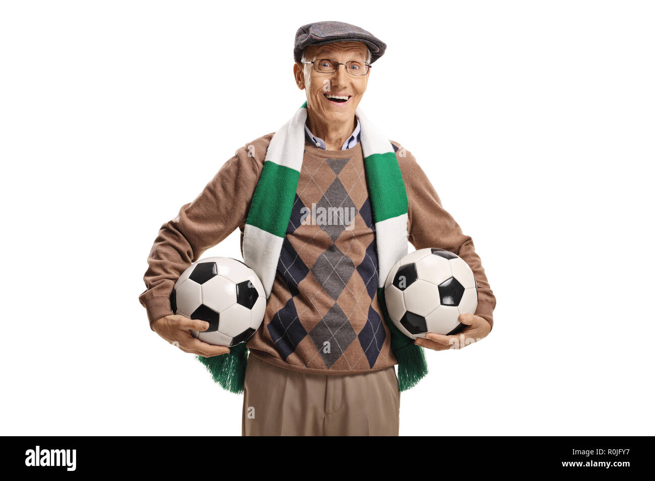 Senior soccer fan holding two soccer balls isolated on white background ...