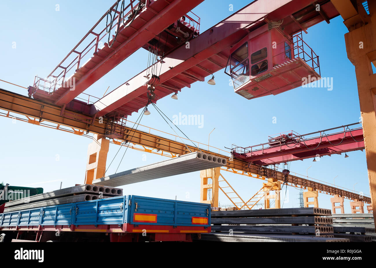 Loading concrete products in truck at construction material factory ...