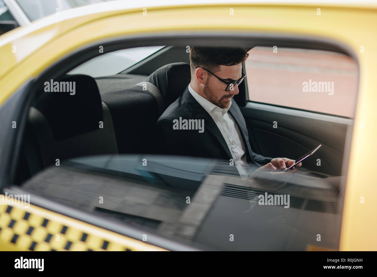 Businessman sitting in cab hi-res stock photography and images - Alamy